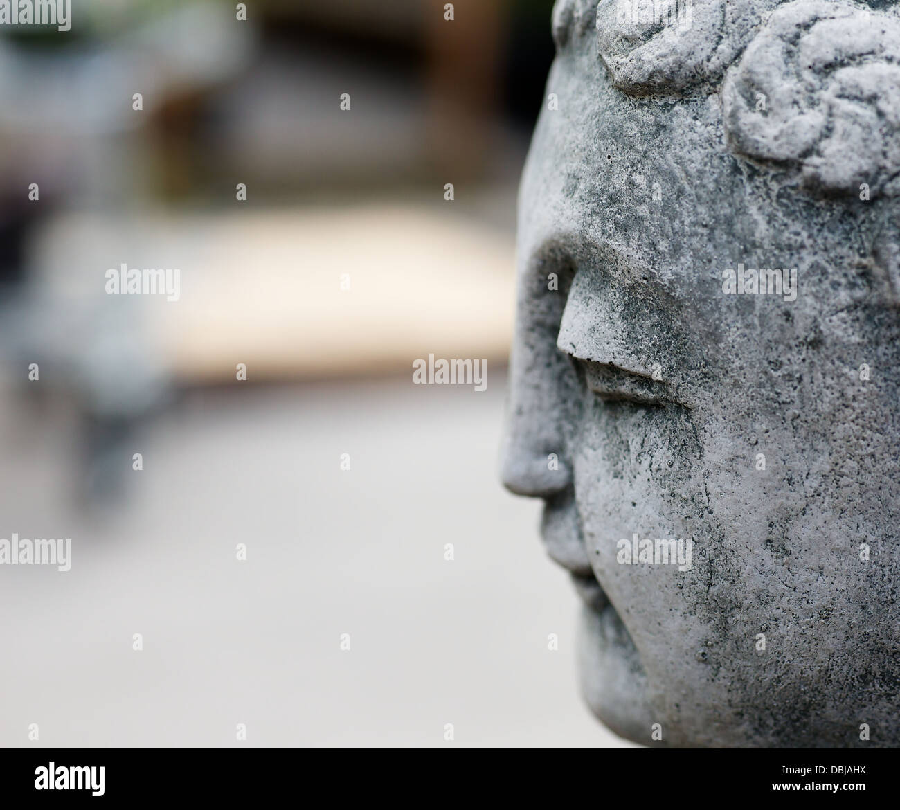 Asian Stone Statue Portrait with soft focus background Stock Photo - Alamy