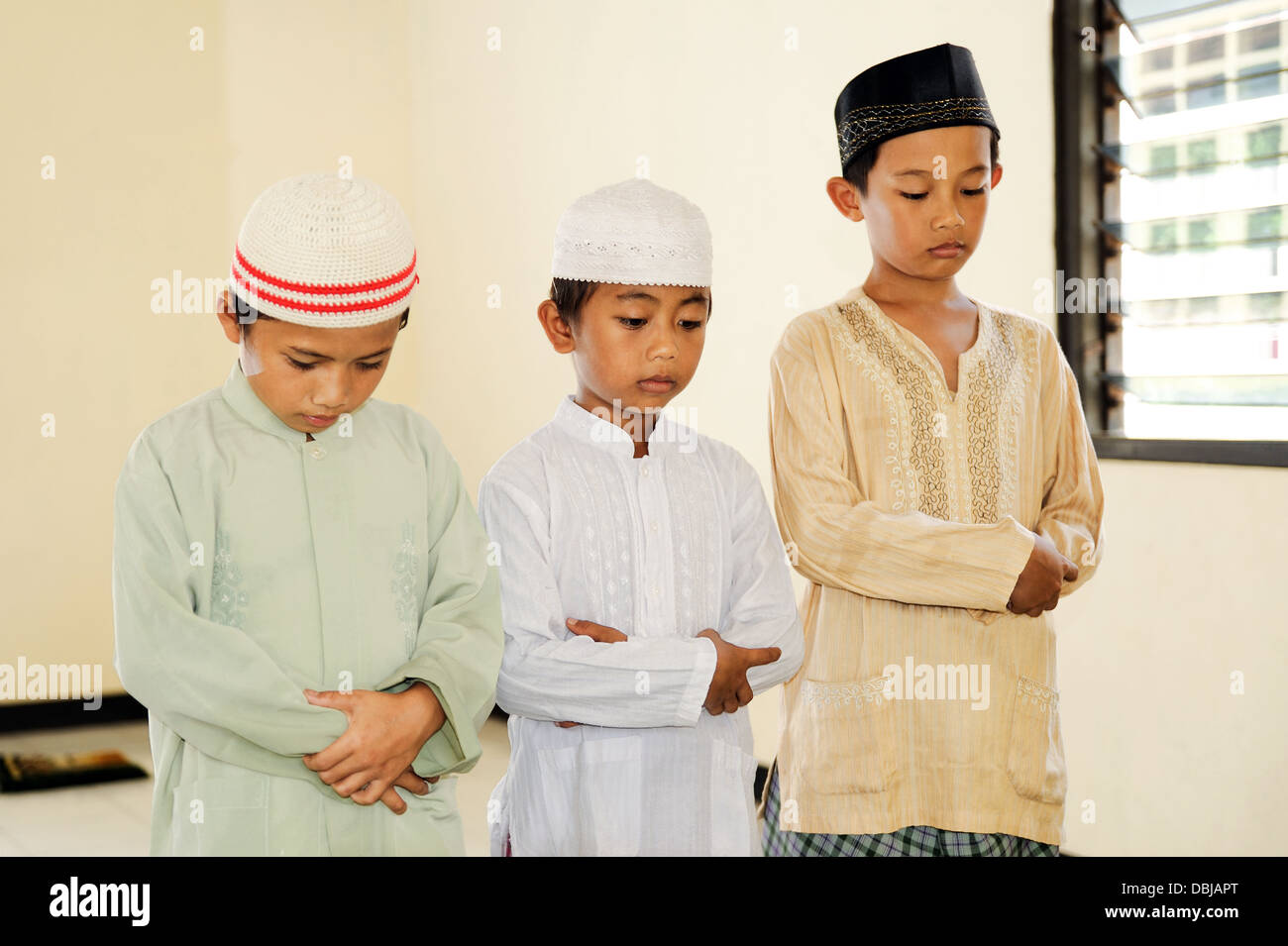 Muslim Kids Praying Stock Photo - Alamy