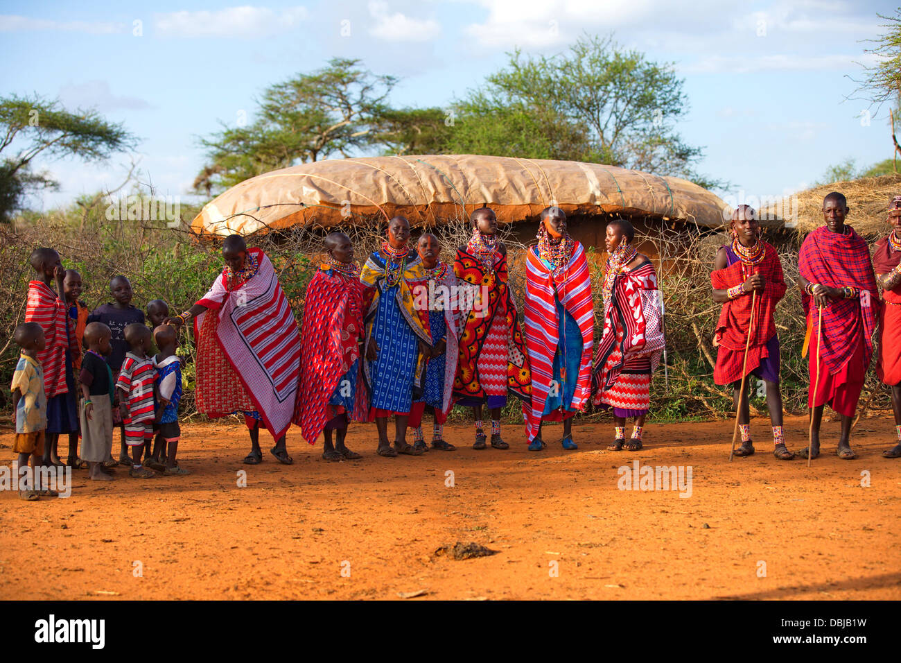Masai Villagers in traditional clothing outside boma. Selenkay ...