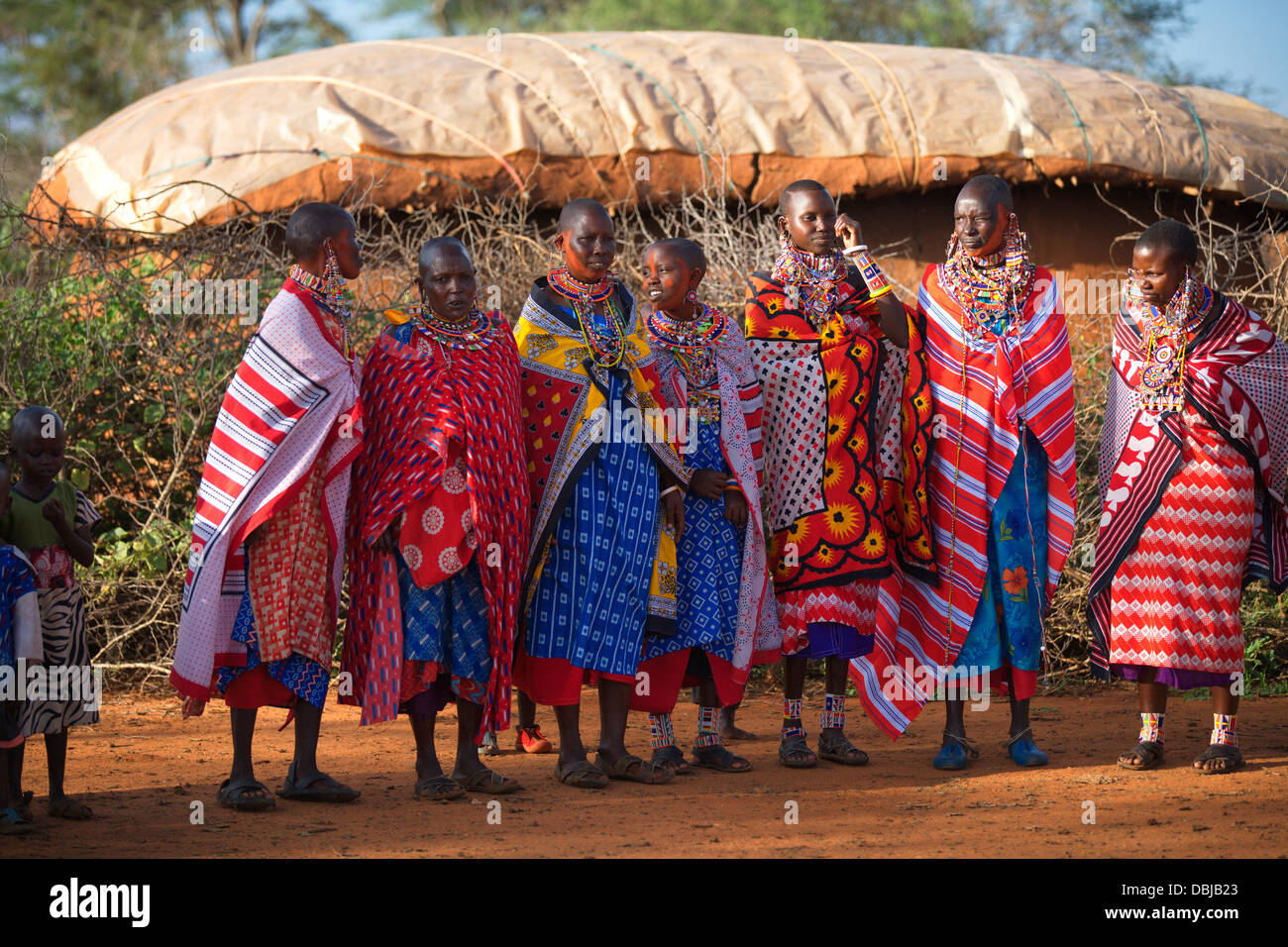Masai Villagers in traditional clothing outside boma. Selenkay ...