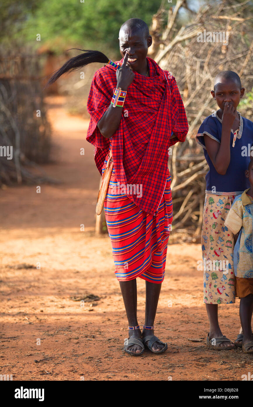 Masai Villagers in traditional clothing outside boma. Selenkay ...