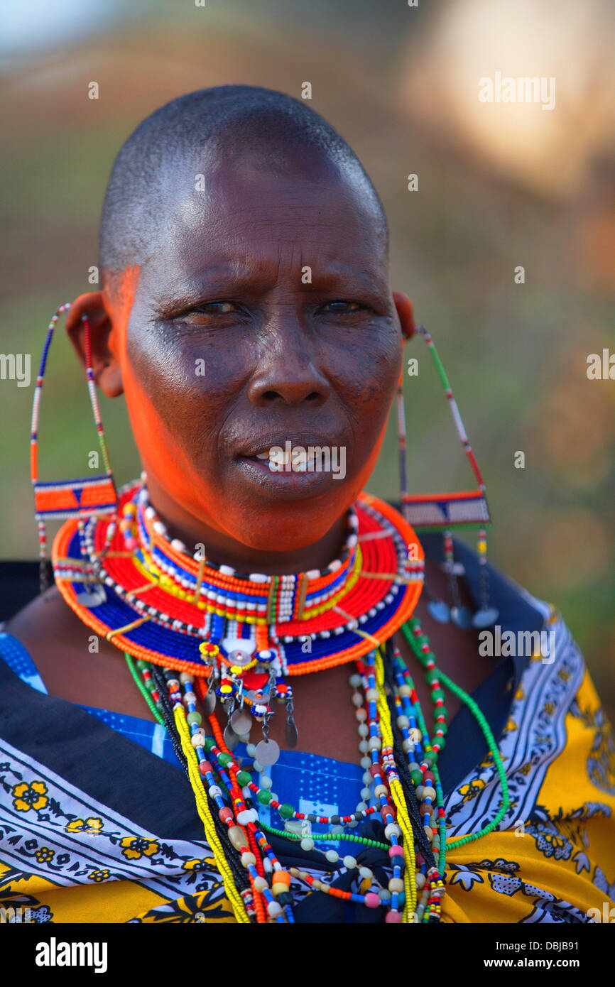 Portrait of old Masai Woman in traditional clothing and jewelry ...
