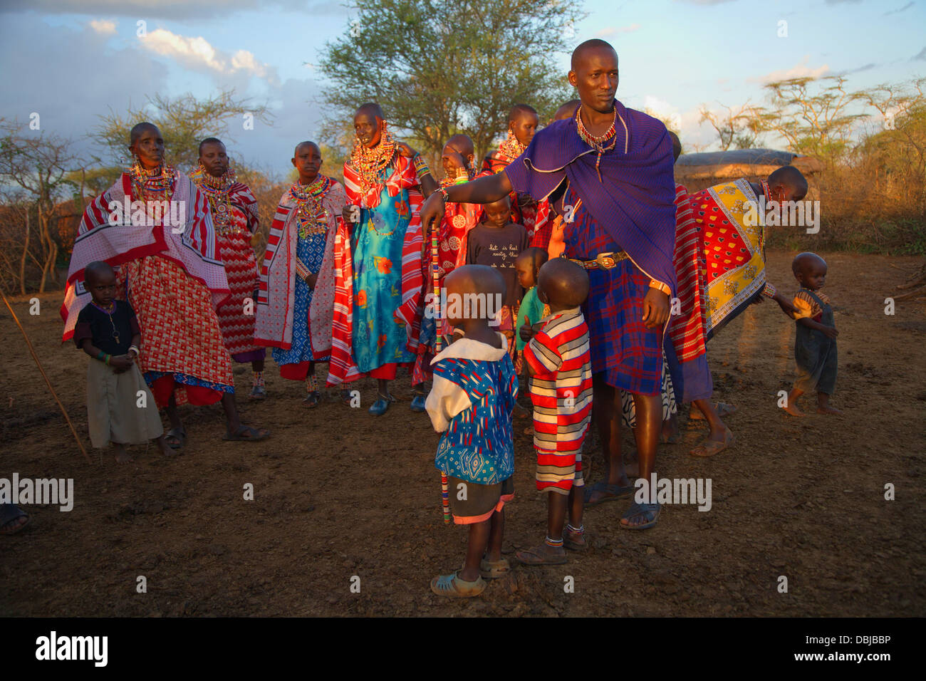 Masai Villagers in traditional clothing mingling around their bomas ...