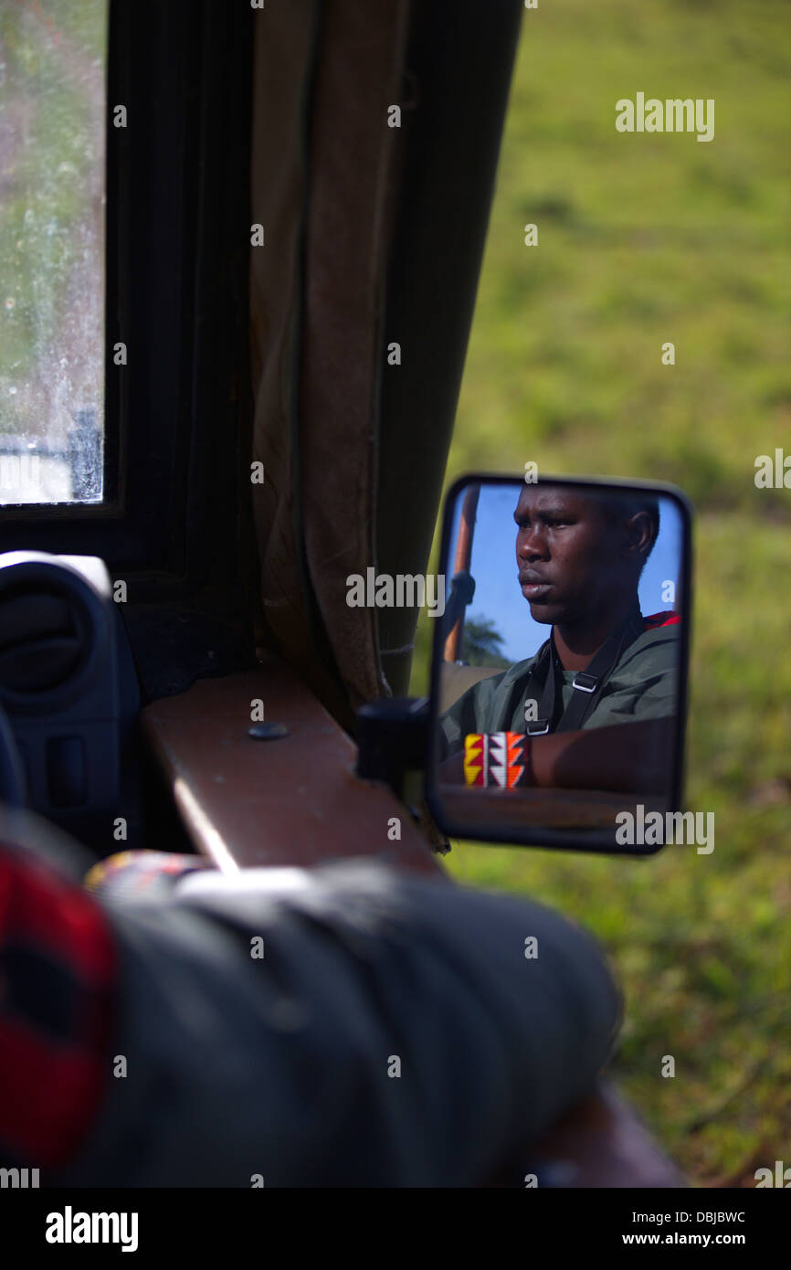 Picture of Masai safari guide in rear view mirror of jeep in Ol Kinyei ...
