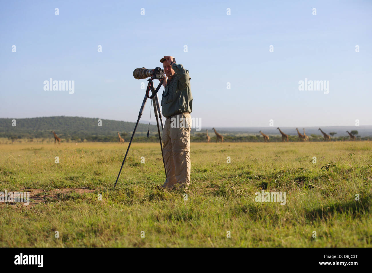 Nature Photographer Wayne Hughes working in the Ol Kinyei Conservancy ...
