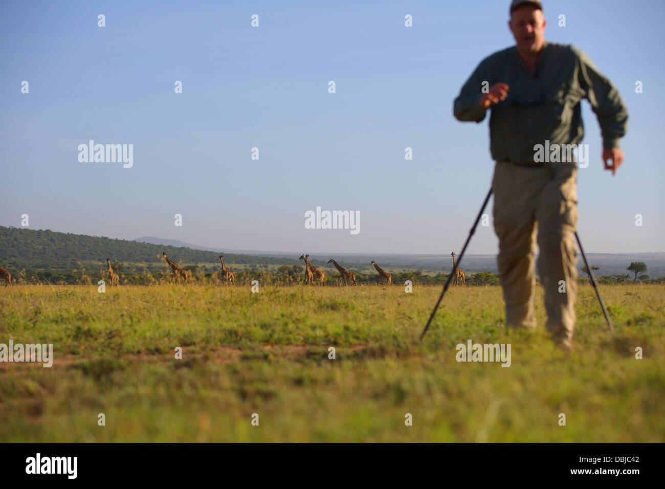 Nature Photographer Wayne Hughes working in the Ol Kinyei Conservancy ...