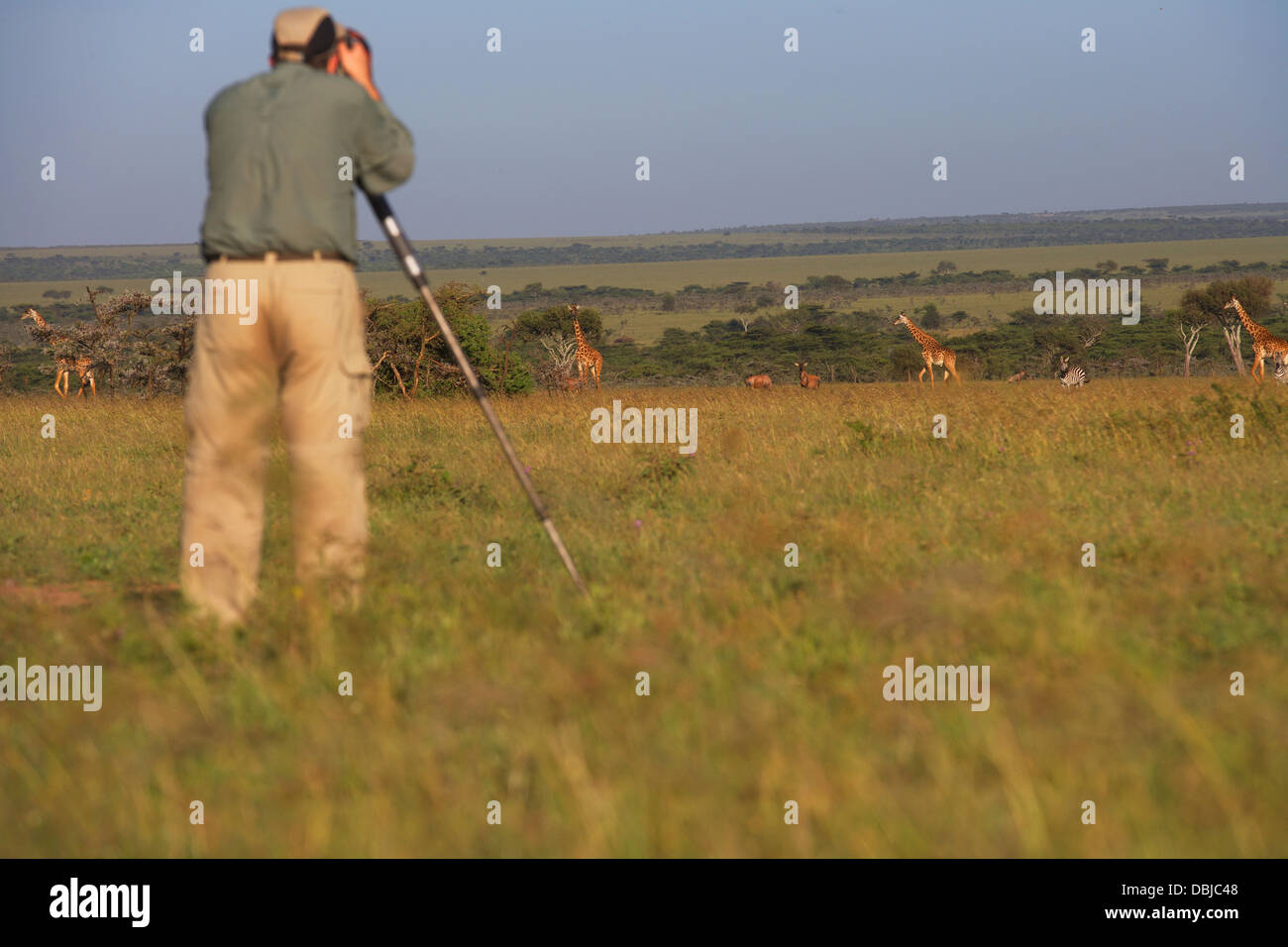 Nature Photographer Wayne Hughes working in the Ol Kinyei Conservancy ...