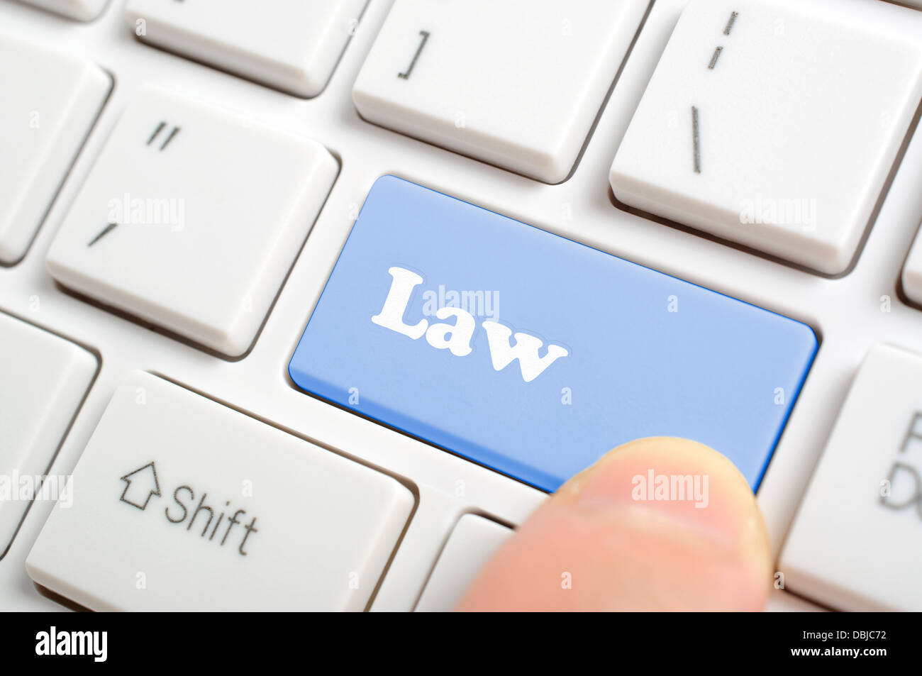 Pressing law key on keyboard Stock Photo - Alamy