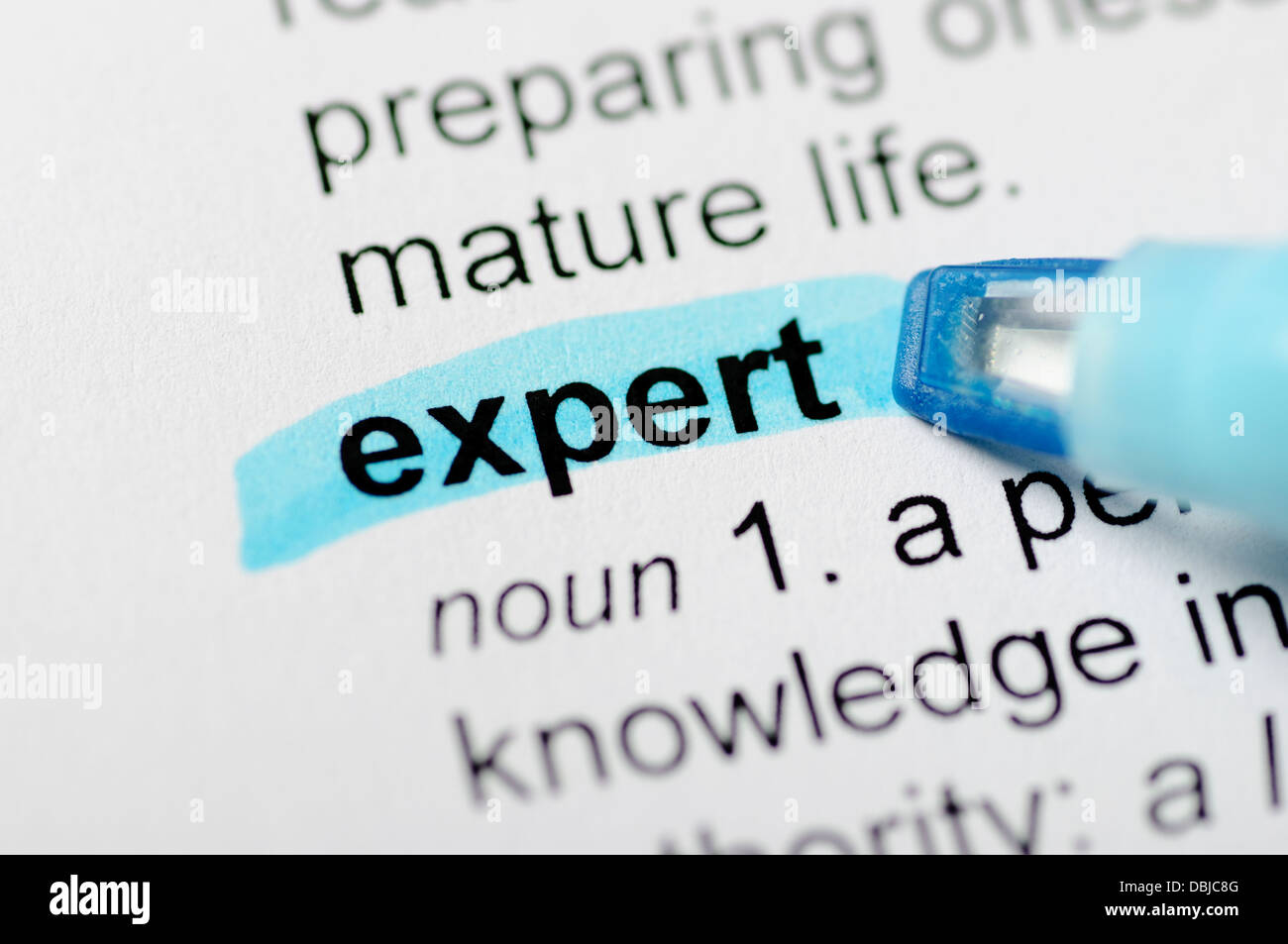 Blue marker on expert word Stock Photo - Alamy