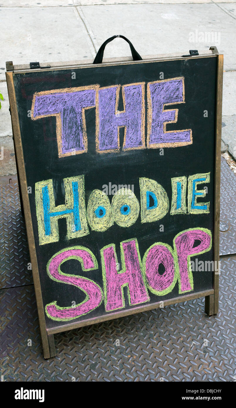 Sign in front of a store selling hoodies in NYC Stock Photo - Alamy