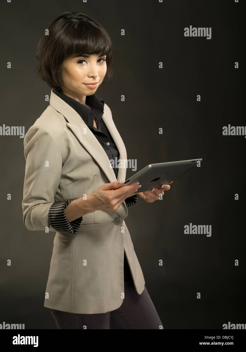 Young woman using apple ipad hi-res stock photography and images - Alamy