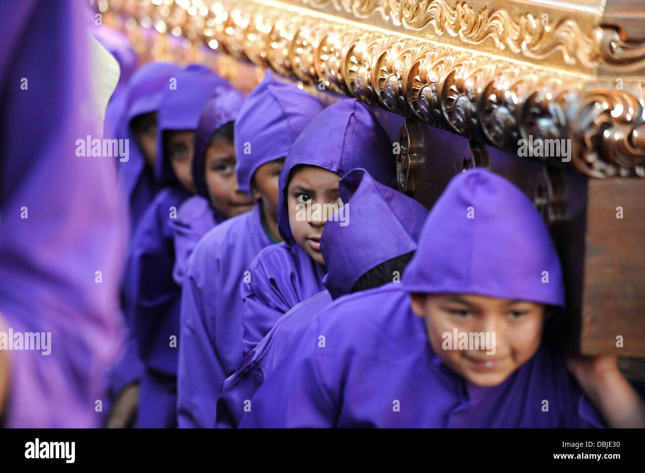 Children carry an anda for procession during Semana Santa (Holy Week ...