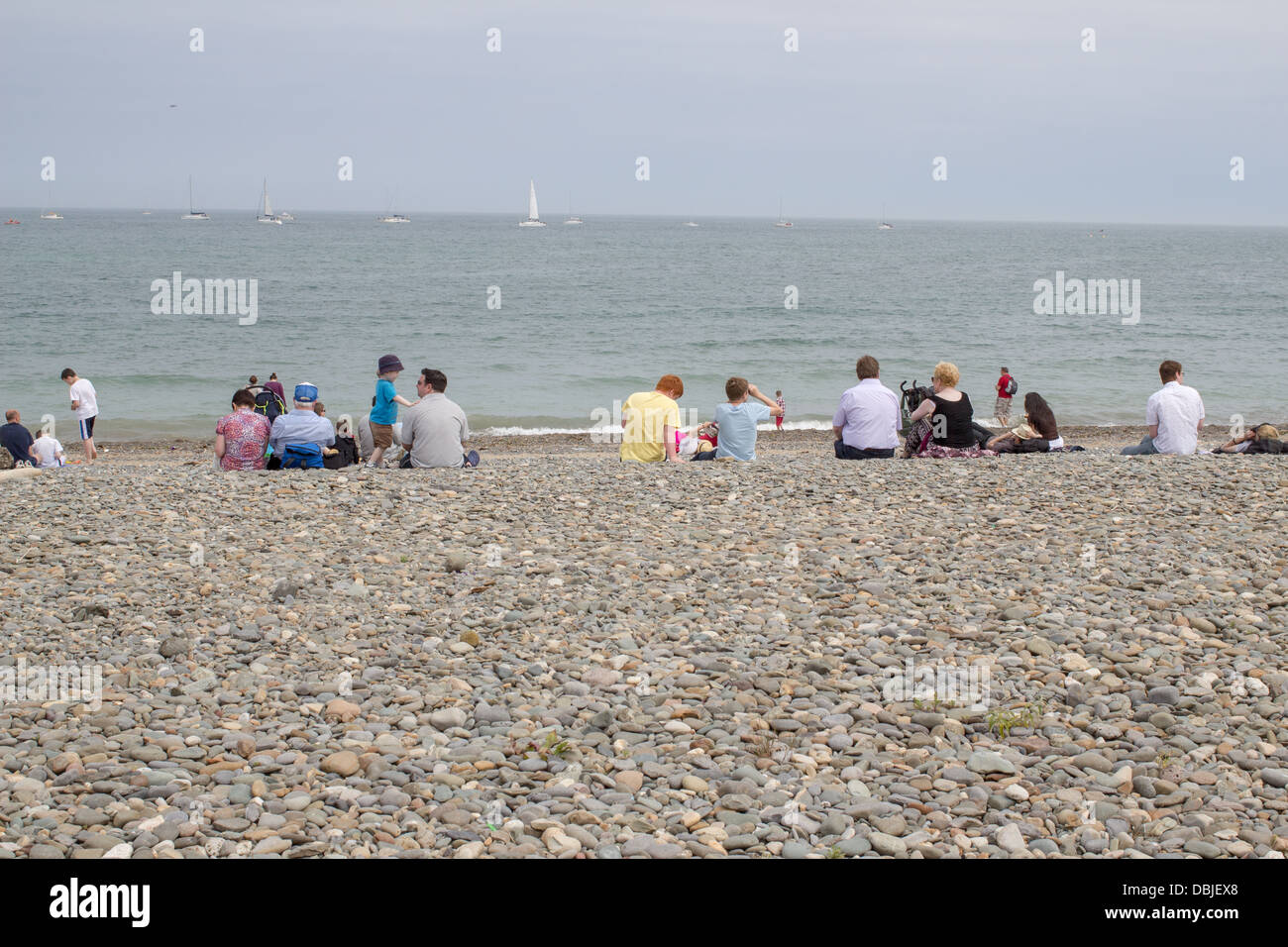 People relaxing on a beach Stock Photo - Alamy