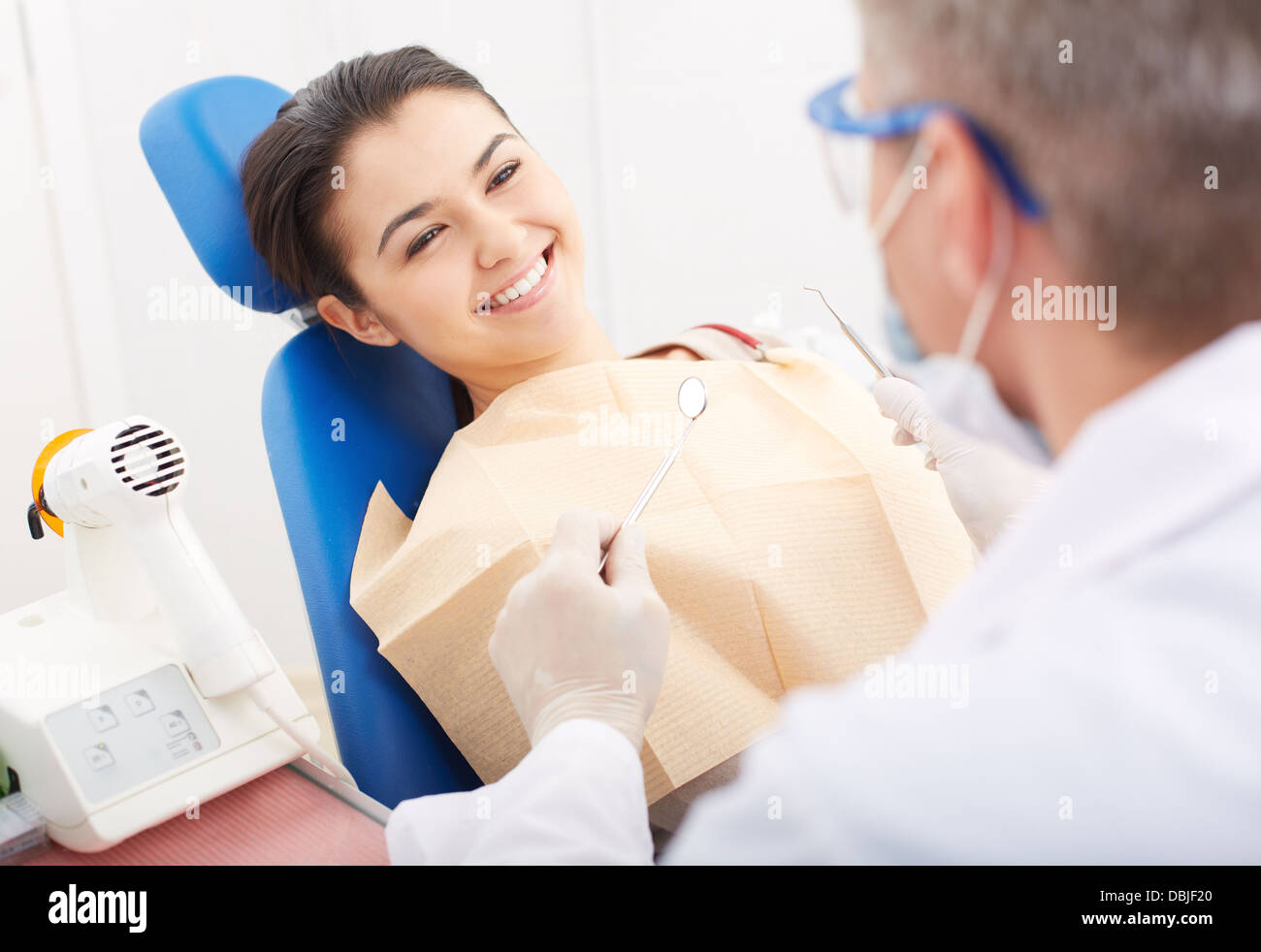 Image of smiling patient looking at the dentist Stock Photo - Alamy