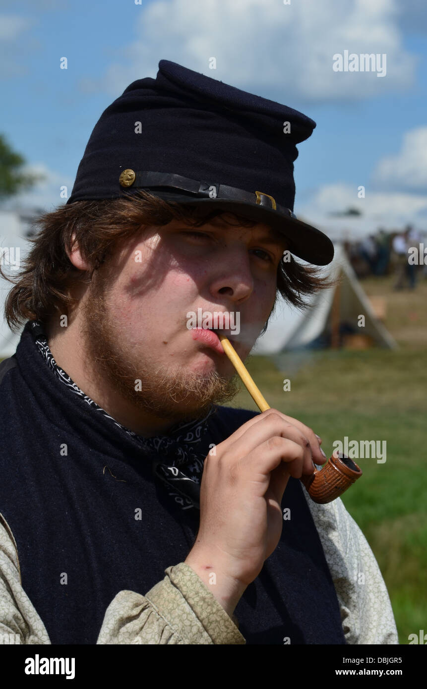 Civil war re-enactment solider smoking pipe in camp Stock Photo - Alamy