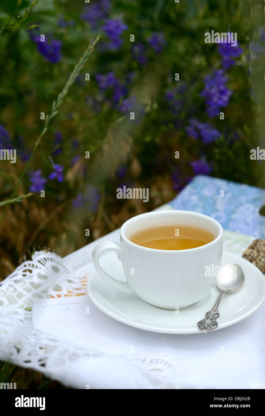 Сup of tea and sweets on a tray Stock Photo - Alamy