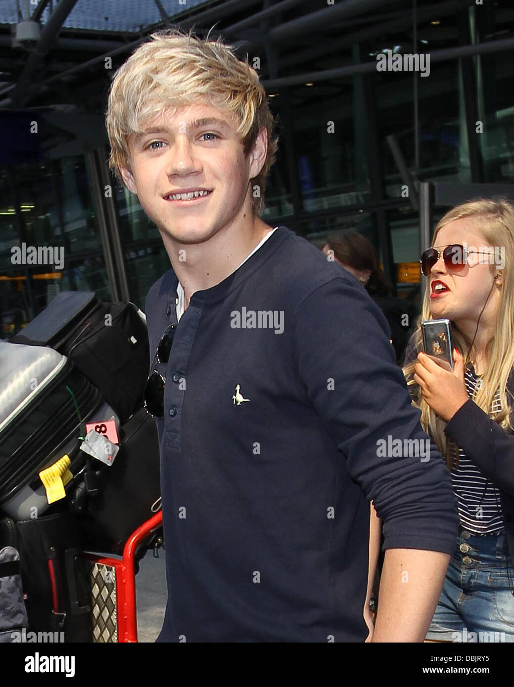 Niall Horan of One Direction arriving at Heathrow airport on a flight ...