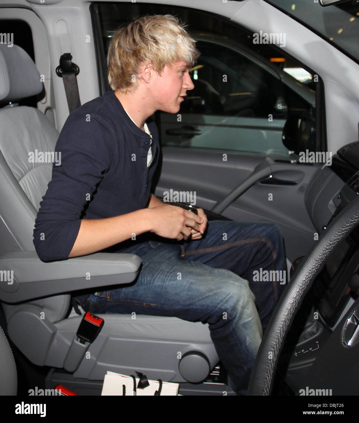 Niall Horan of One Direction arriving at Heathrow airport on a flight ...