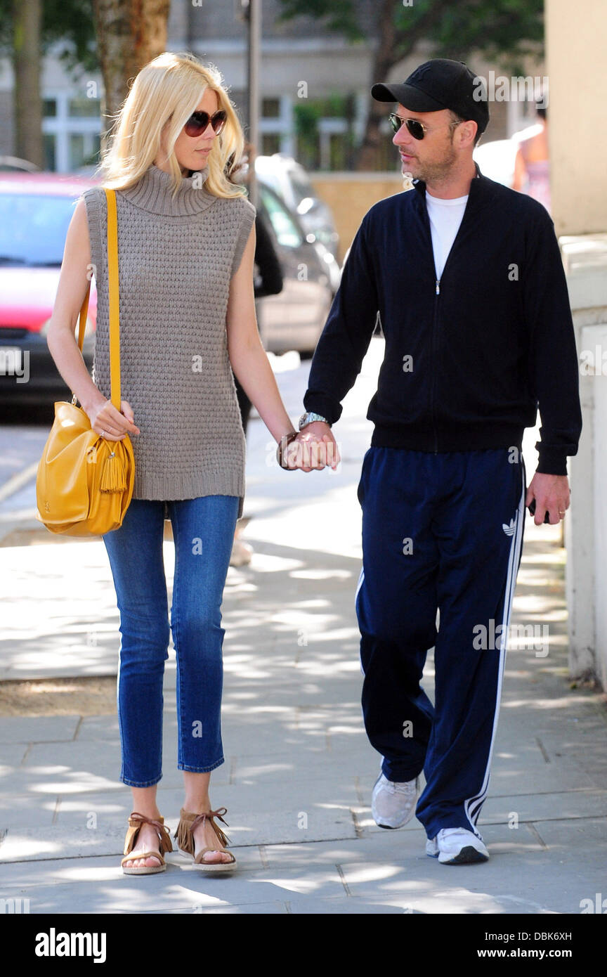 Claudia Schiffer and her husband Matthew Vaughn hold hands after ...