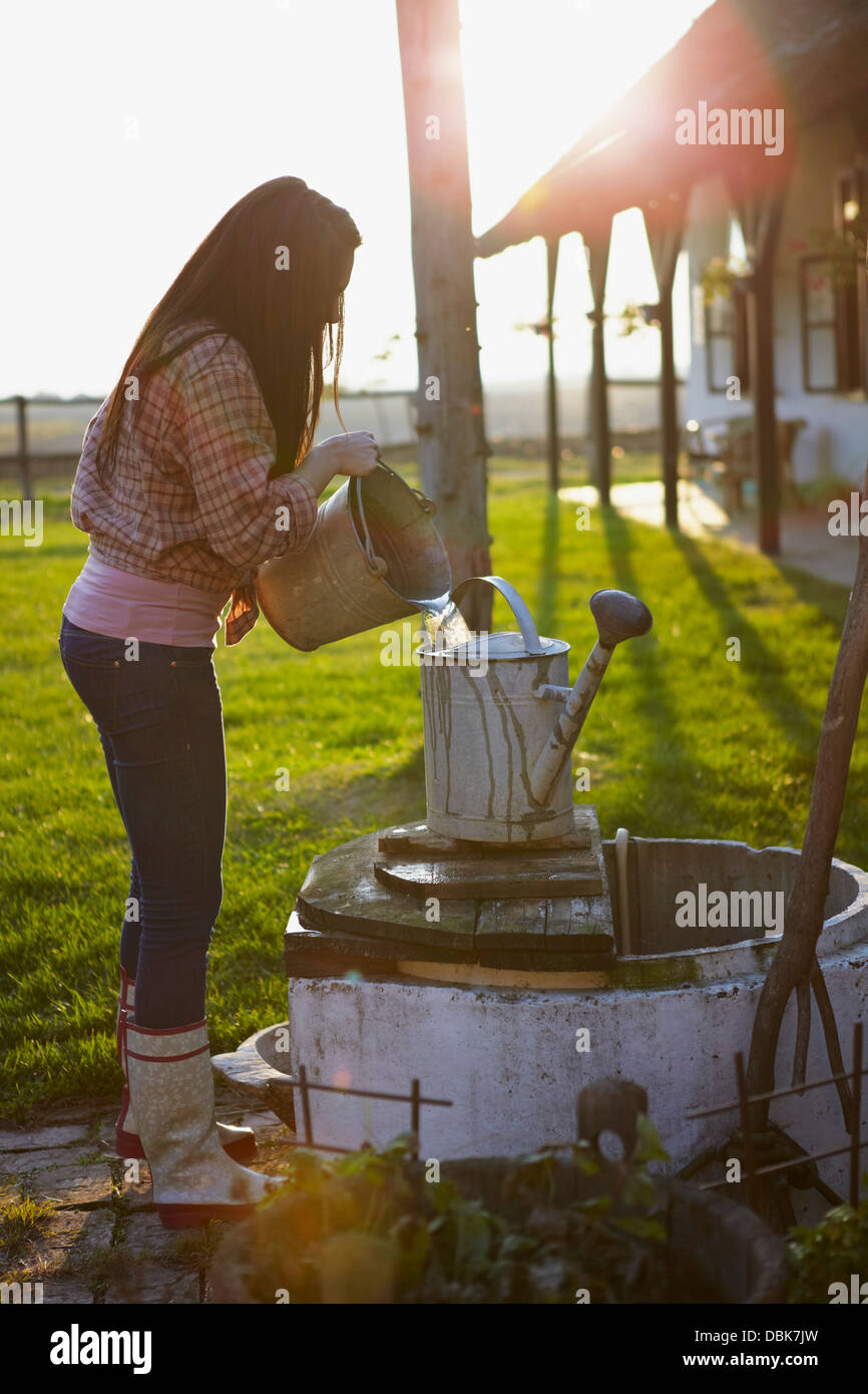 Pouring water bucket hi-res stock photography and images - Alamy