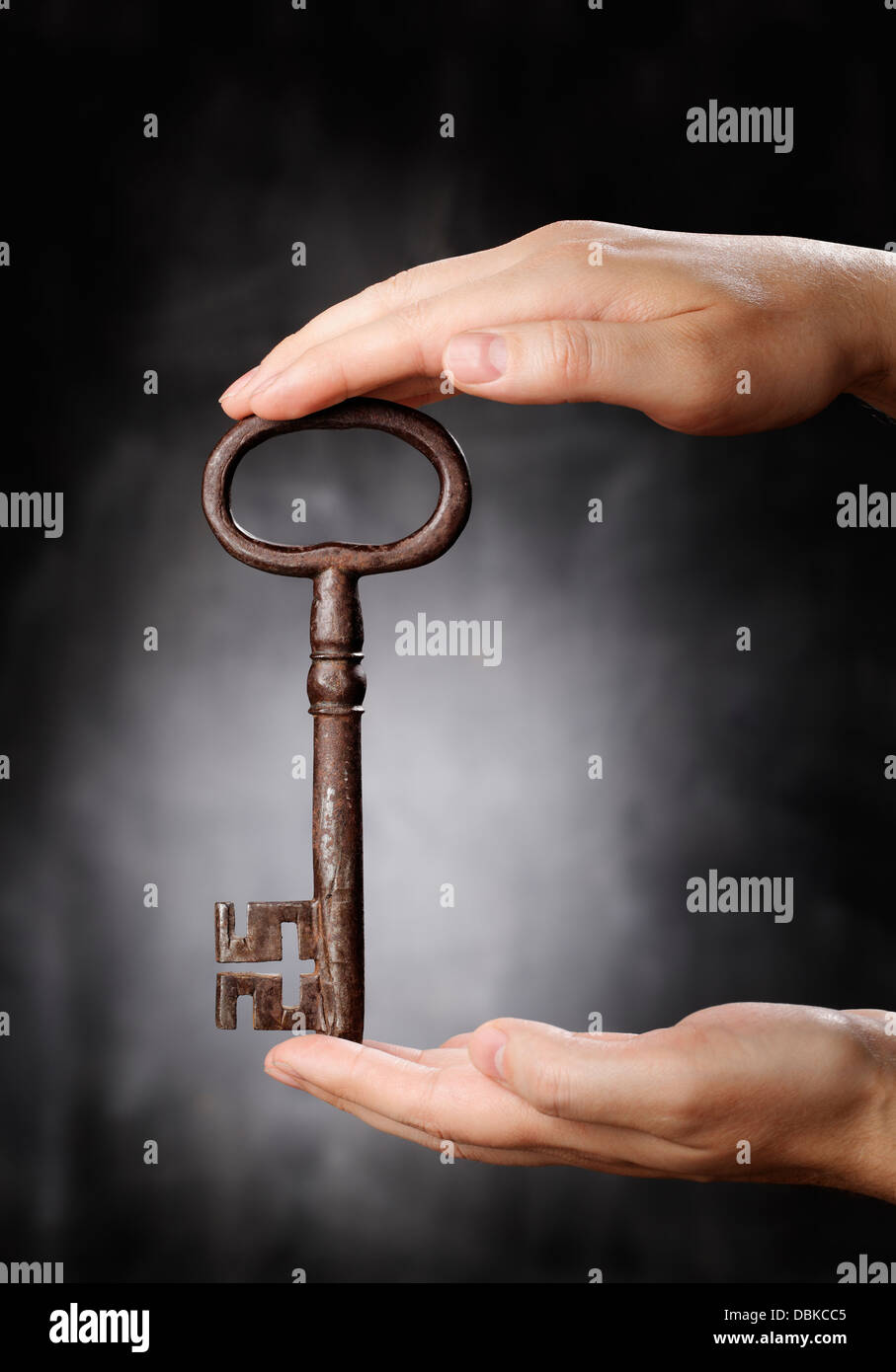 Man holding big old antique skeleton key in his hands Stock Photo - Alamy