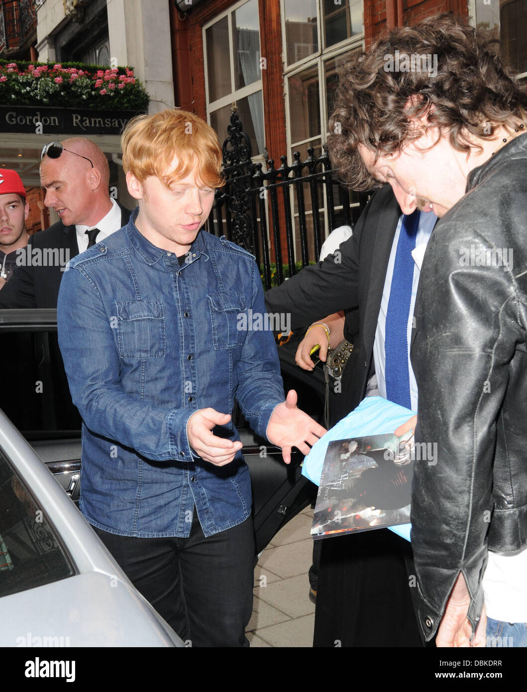 Harry Potter star, Rupert Grint, signs autographs outside Claridges ...