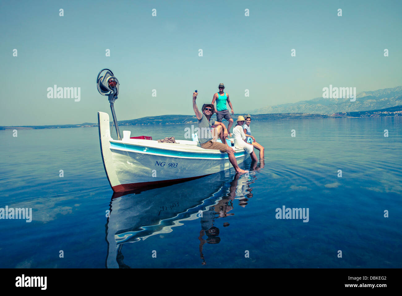 Four people in boat hi-res stock photography and images - Alamy