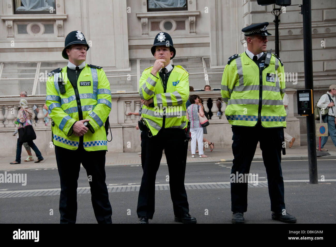 London metropolitan Police bored and watching and policing a protest ...