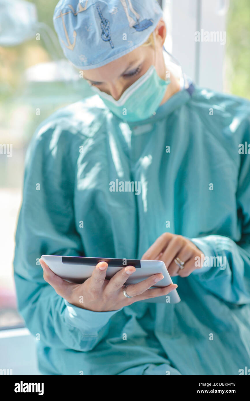 Female Surgeon Using Tablet PC Stock Photo - Alamy