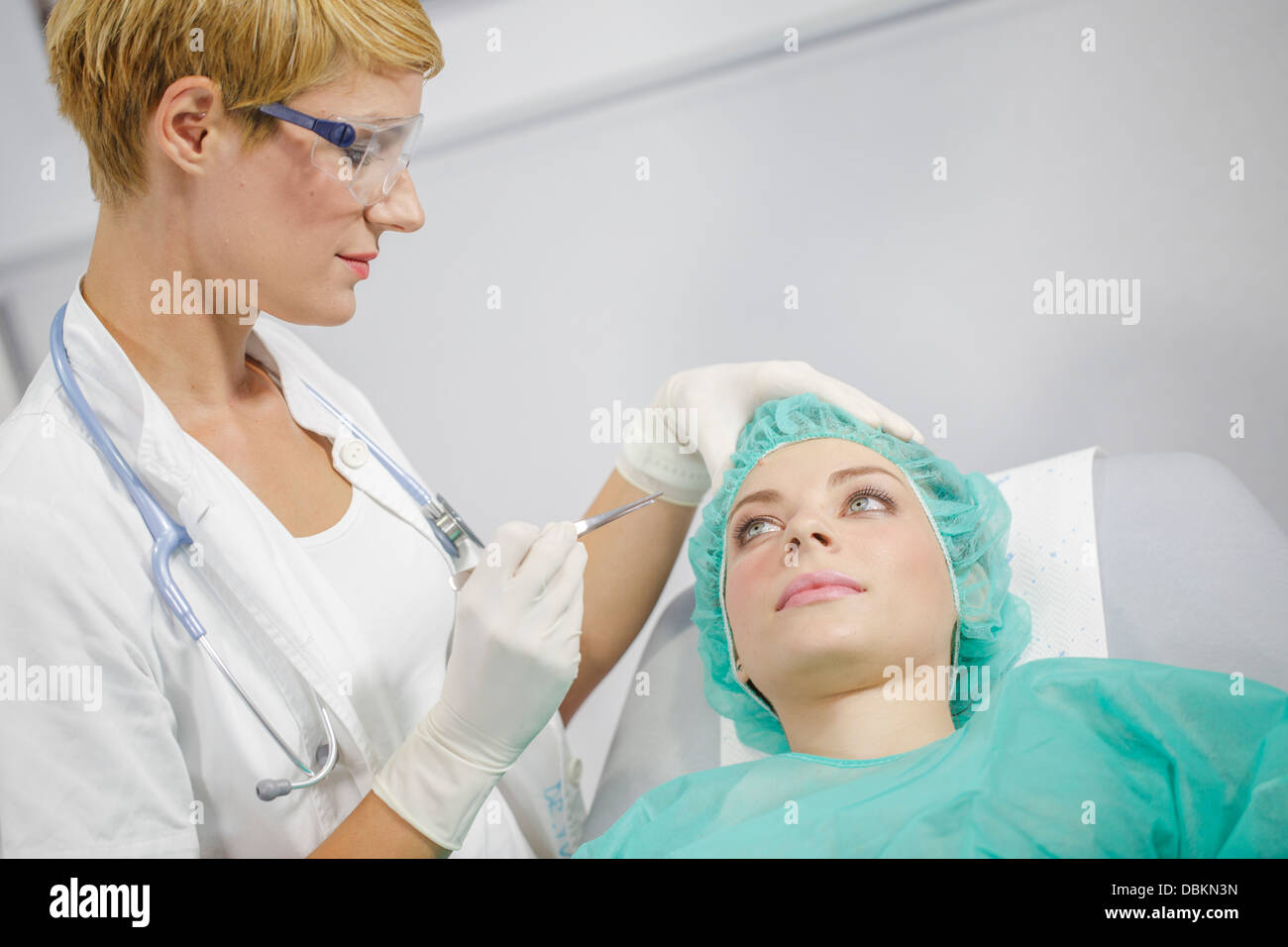 Patient In Treatment Stock Photo - Alamy