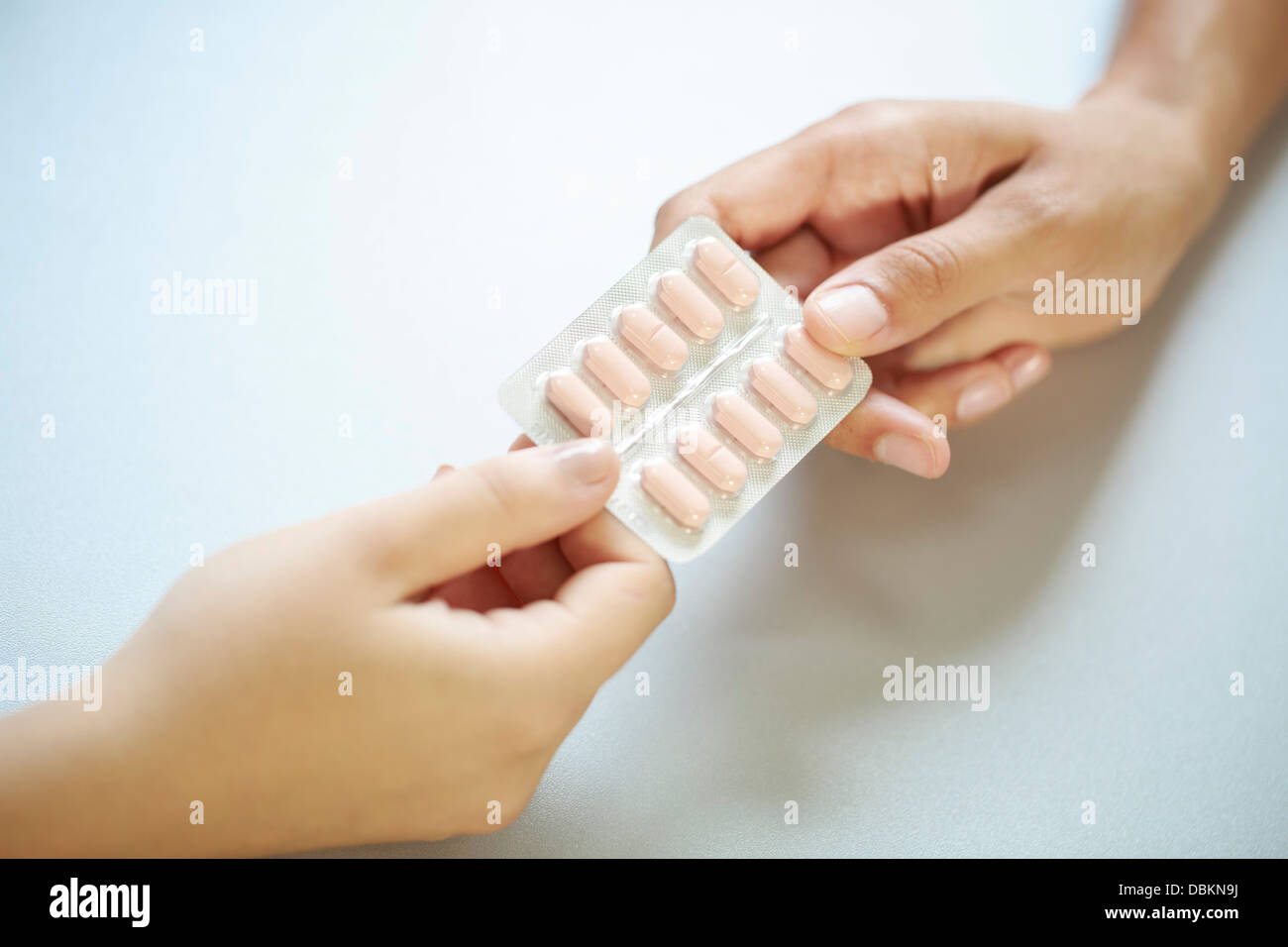 Handing Over Tablets Stock Photo - Alamy