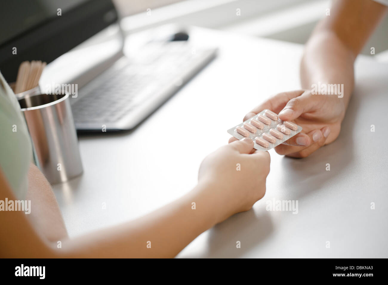 Handing Over Tablets Stock Photo - Alamy