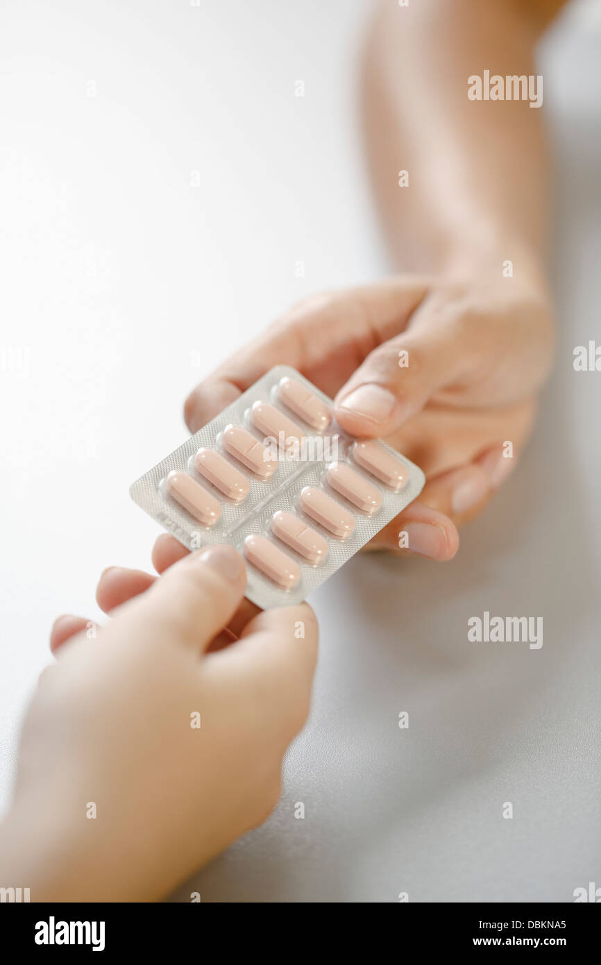 Handing Over Tablets Stock Photo - Alamy