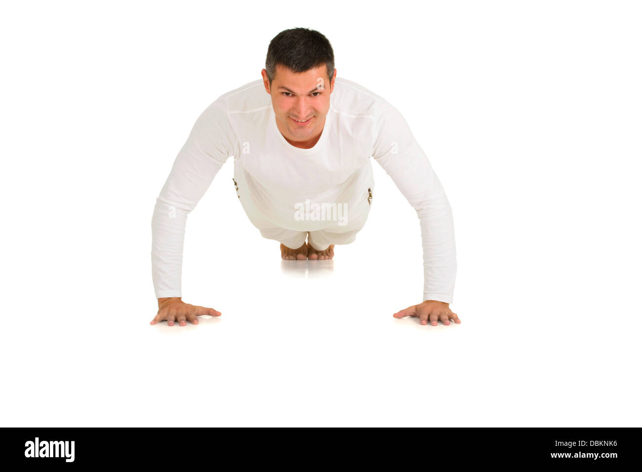 man in white does push-ups Stock Photo - Alamy