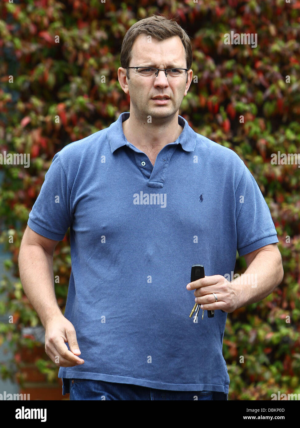 Former News of the World editor Andy Coulson leaves his home to go out ...
