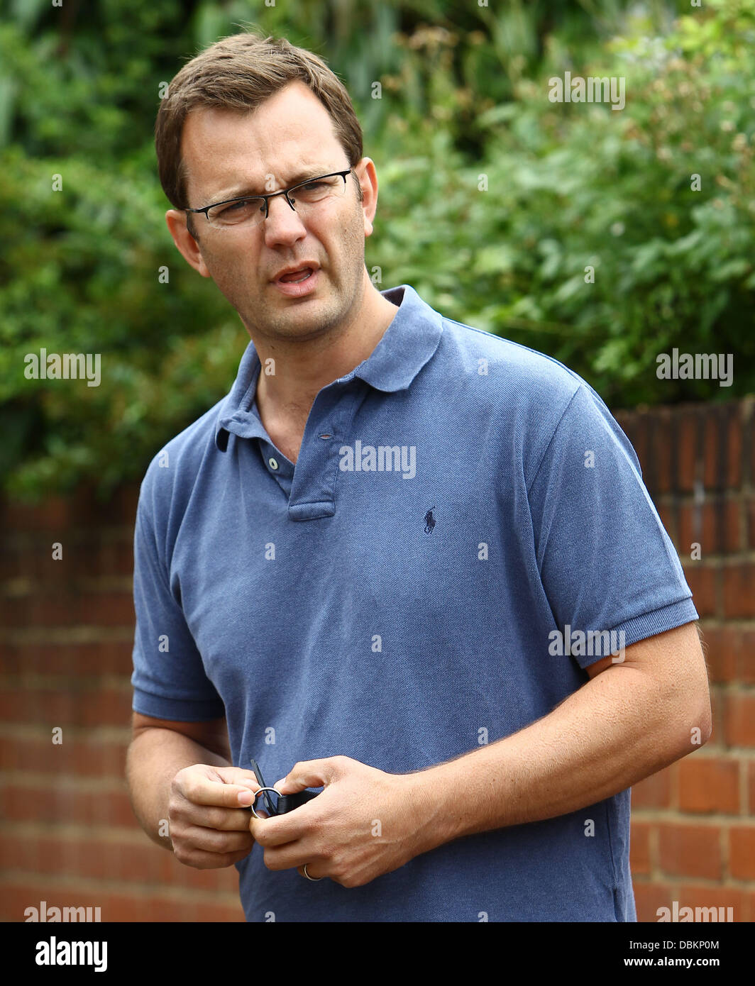 Former News of the World editor Andy Coulson leaves his home to go out ...