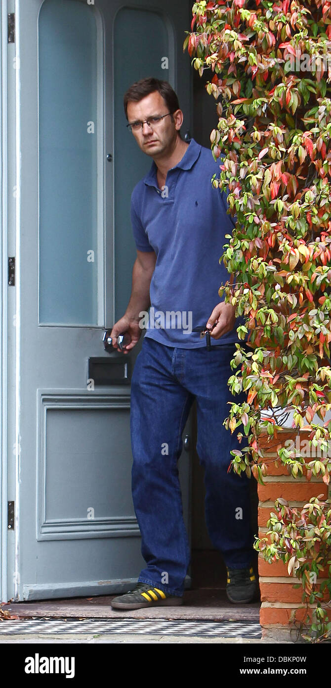 Former News of the World editor Andy Coulson leaves his home to go out ...