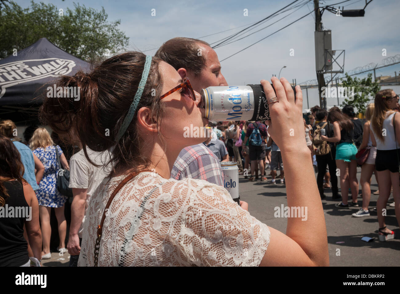 Hipsters drink beer and and buy food from food trucks at the annual ...
