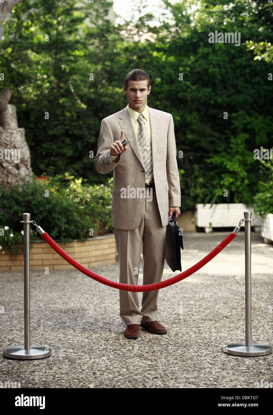 People waiting behind barrier hi-res stock photography and images - Alamy