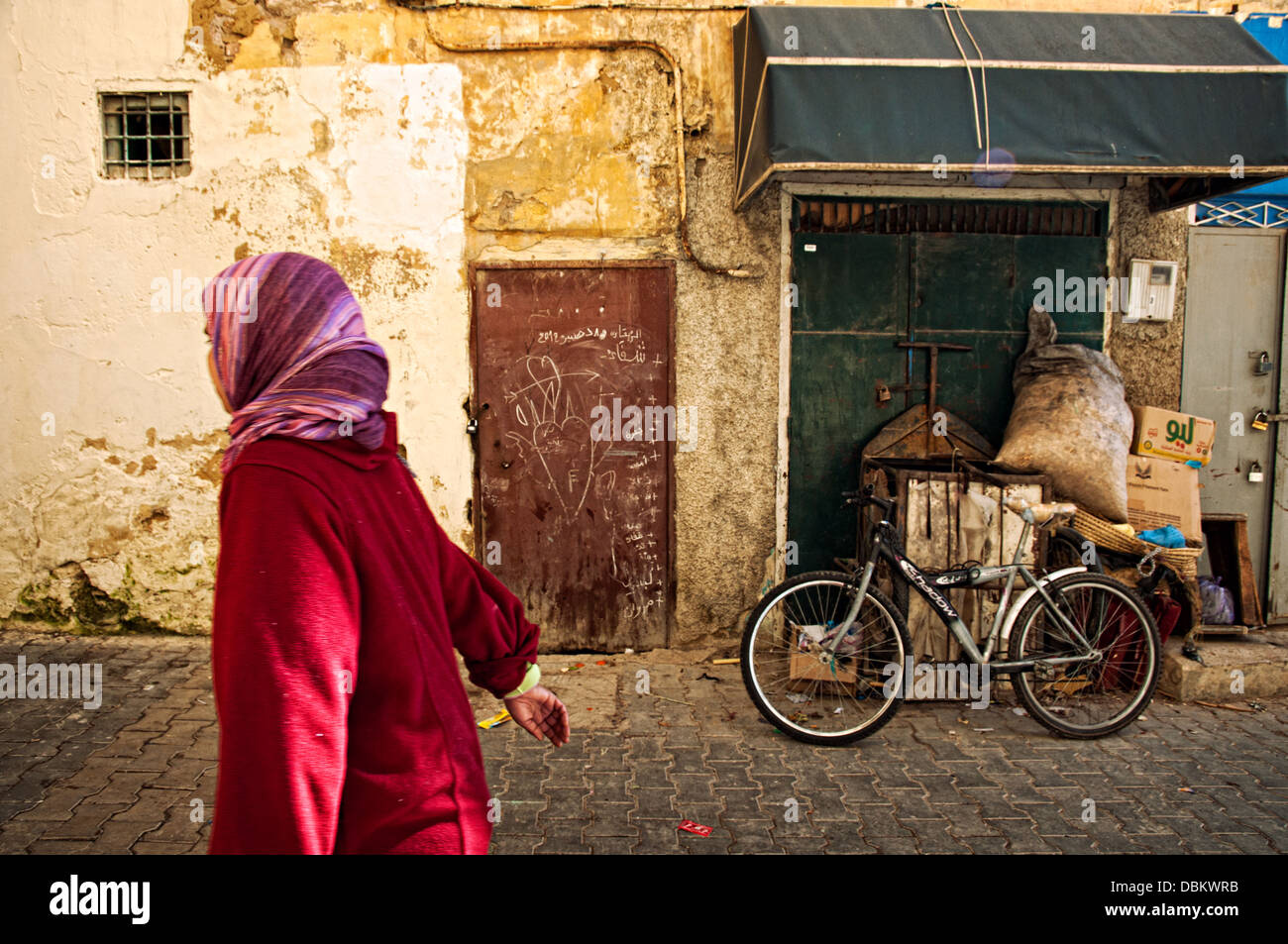 Woman walking on the streets of the old medina. Meknes, Morocco Stock ...
