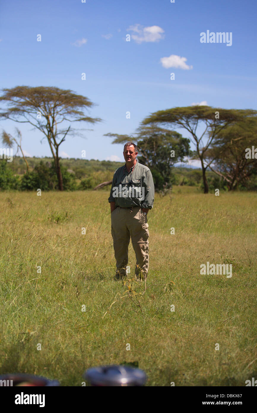 Nature Photographer Wayne Hughes working in the Ol Kinyei Conservancy ...