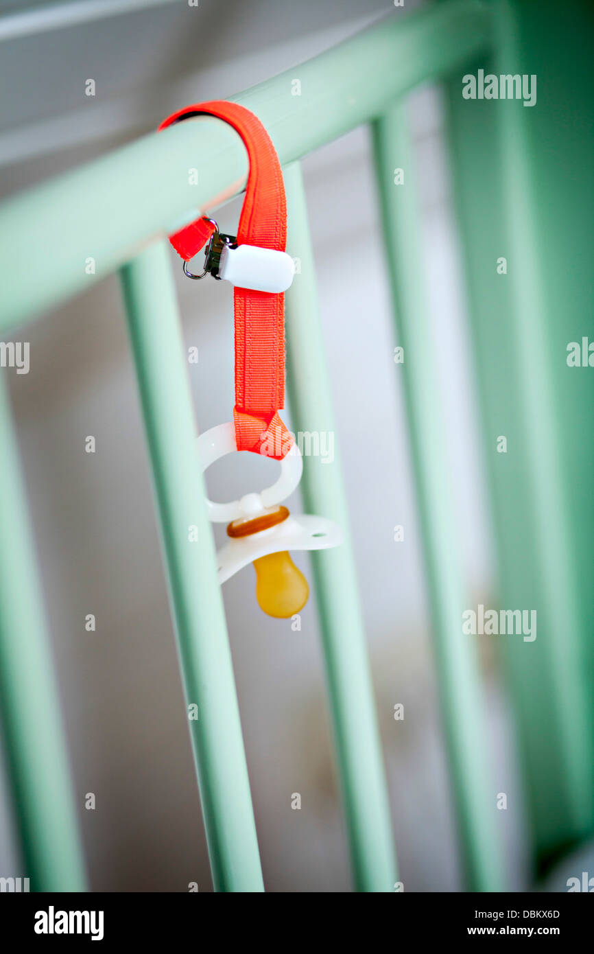 Baby's Pacifier Hanging On Baby Crib, Munich, Bavaria, Germany Stock ...