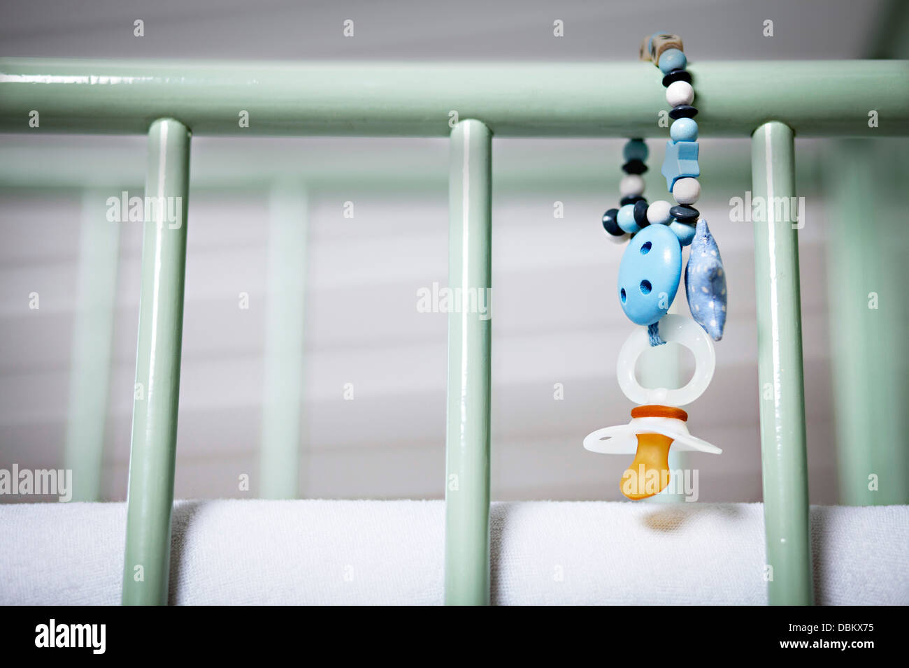 Baby's Pacifier Hanging On Baby Crib, Munich, Bavaria, Germany Stock ...
