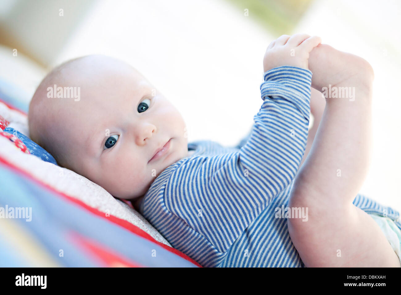 Baby boy lying on back, Munich, Bavaria, Germany Stock Photo - Alamy