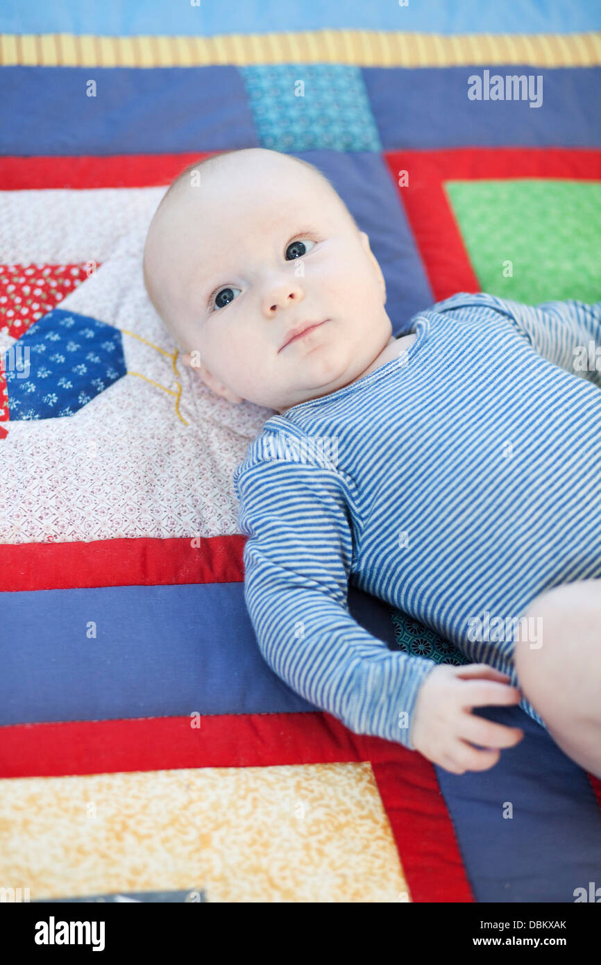 Baby boy lying on back, Munich, Bavaria, Germany Stock Photo - Alamy