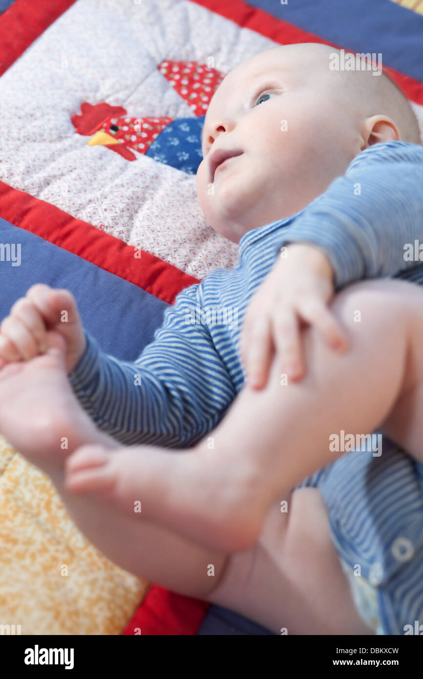 Baby boy lying on back, Munich, Bavaria, Germany Stock Photo - Alamy