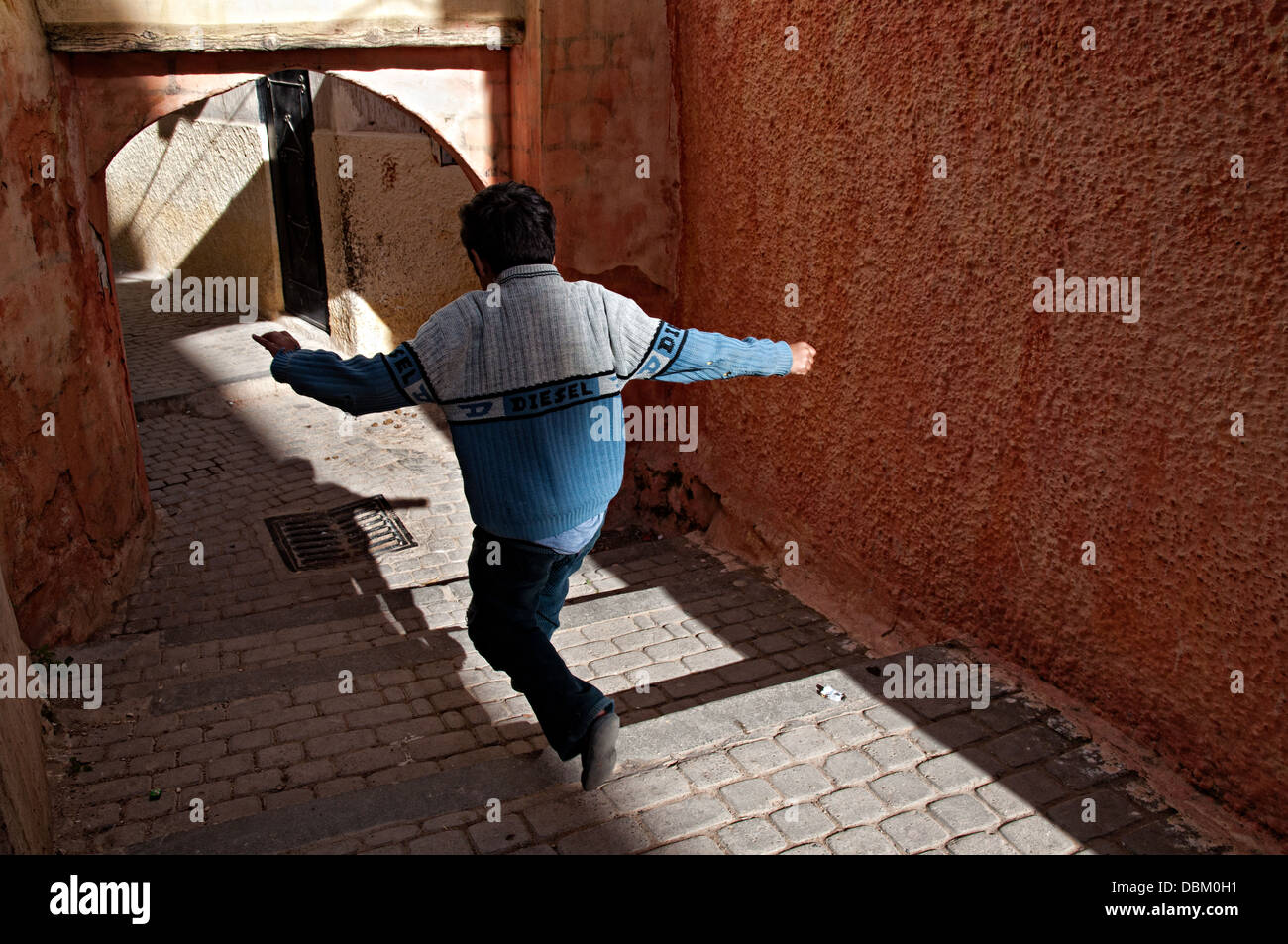 Boy running down steps hi-res stock photography and images - Alamy