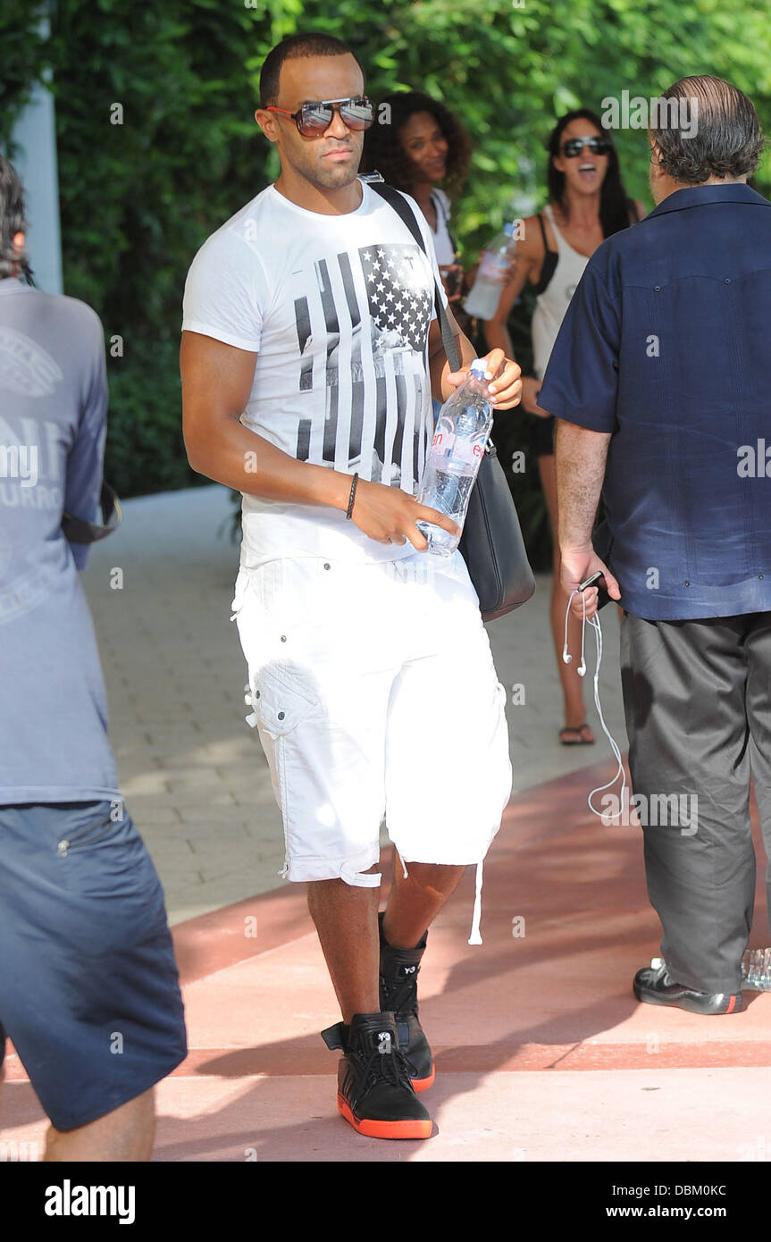 Singer Craig David leaving the W Hotel South Beach in a red Ferrari ...