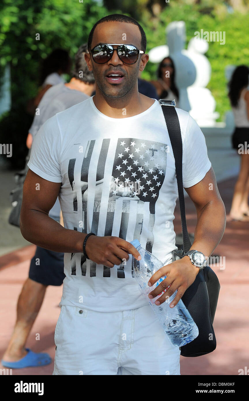 Singer Craig David leaving the W Hotel South Beach in a red Ferrari ...