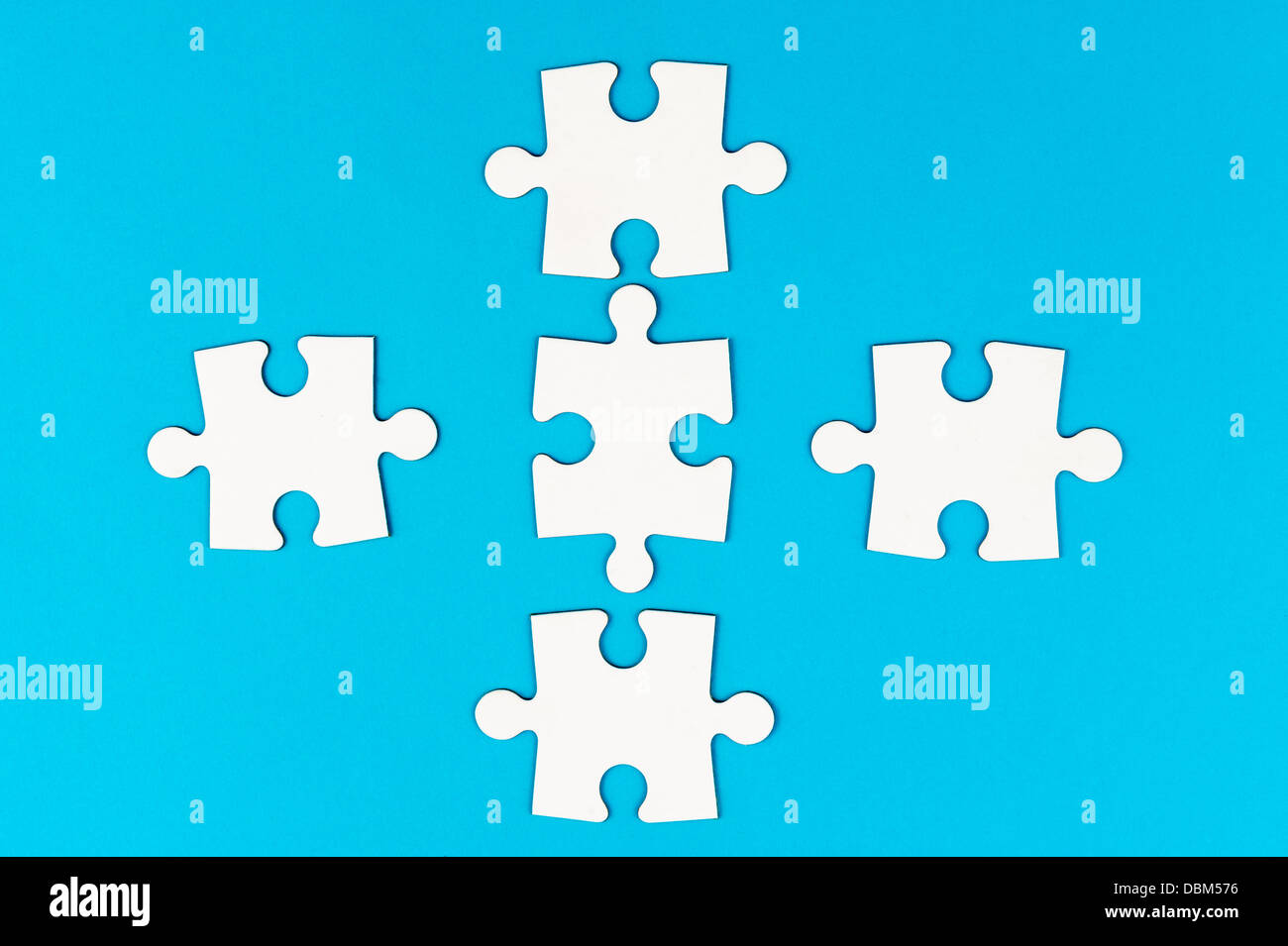Group of white paper jigsaw puzzles Stock Photo - Alamy